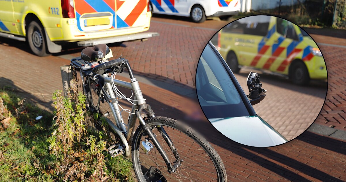 Fietser gaat onderuit na botsing met autospiegel en raakt gewond aan ...